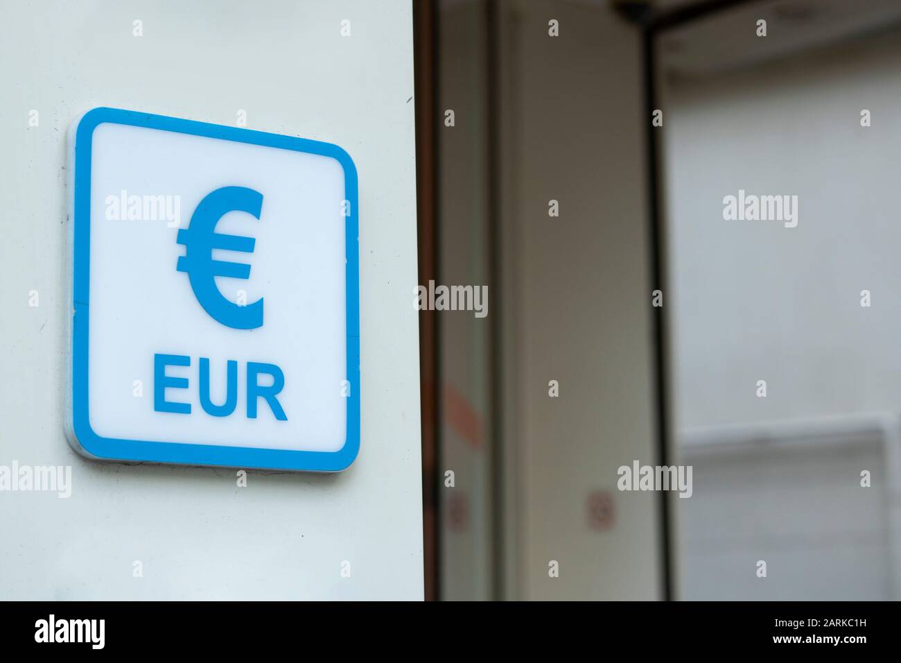 Euro signs. Written in blue on white signboard Stock Photo - Alamy