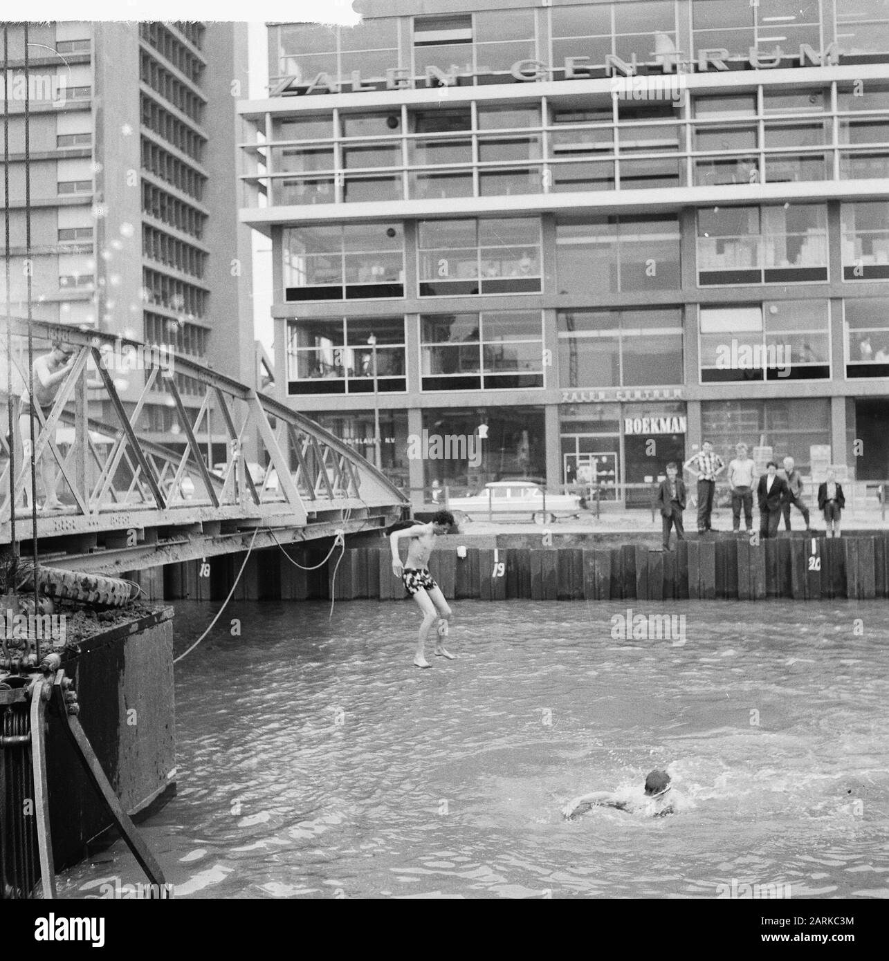 Swimming in Metro-pit. Boys swim in the mud water Date: June 22, 1961 ...