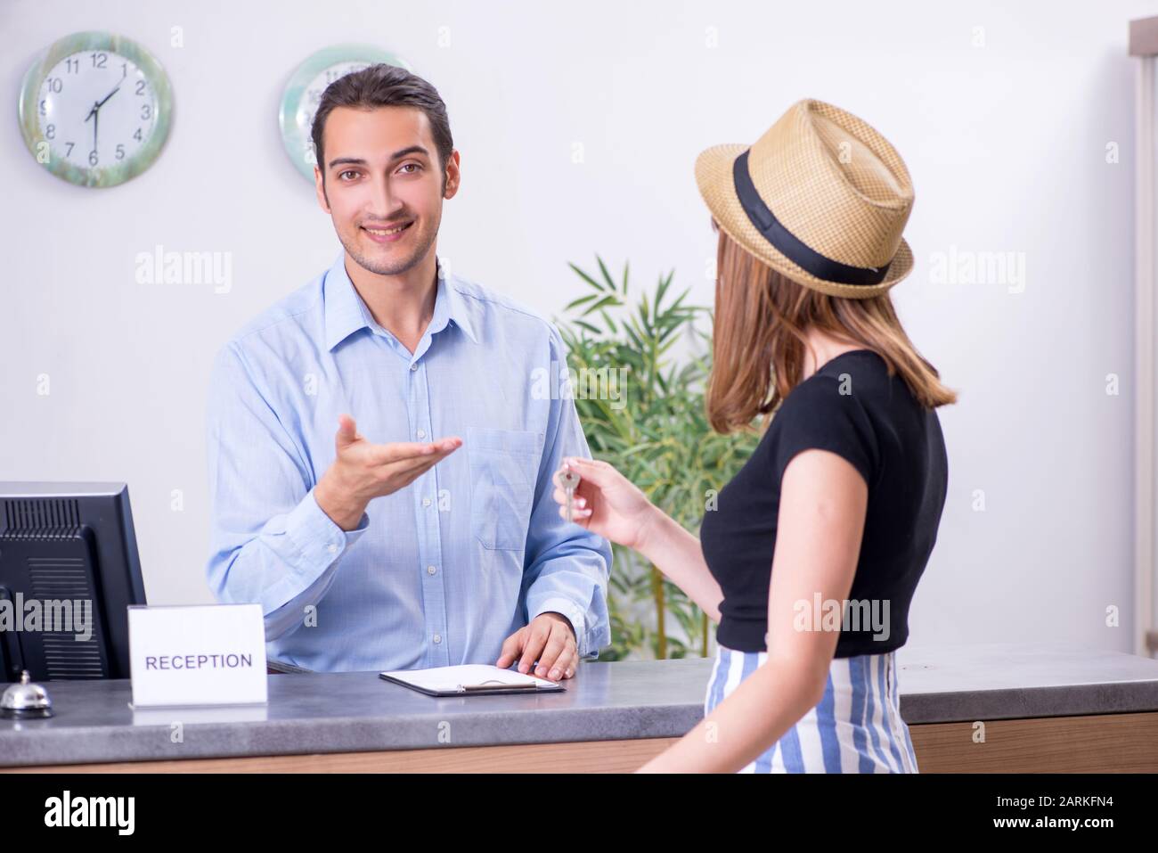 The young woman at hotel reception Stock Photo - Alamy
