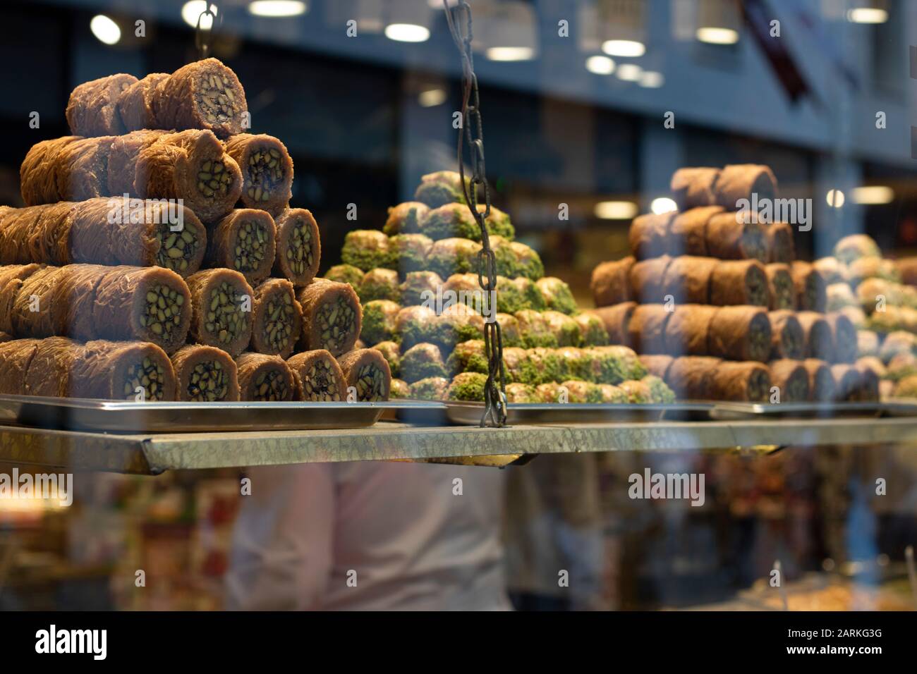 Traditional fresh baklava with pistachio nuts, pyramid shop display ...