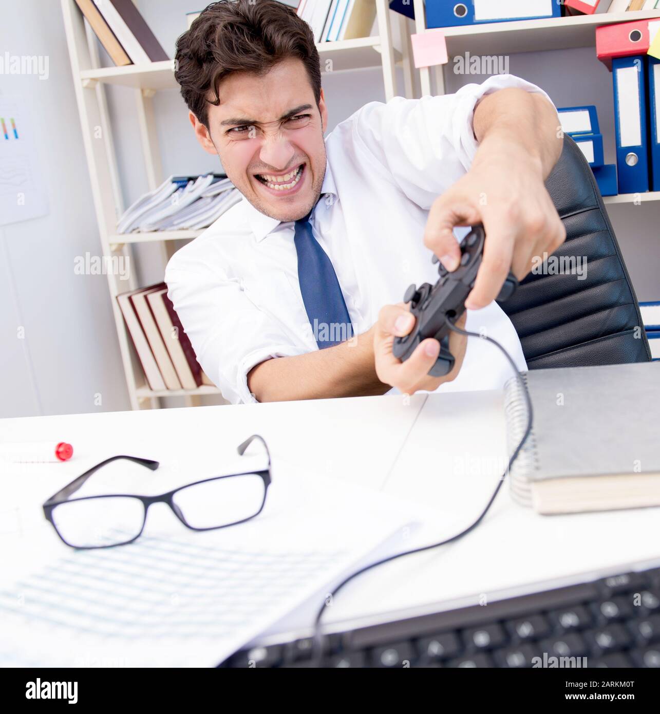 Employee playing computer games in the office Stock Photo - Alamy