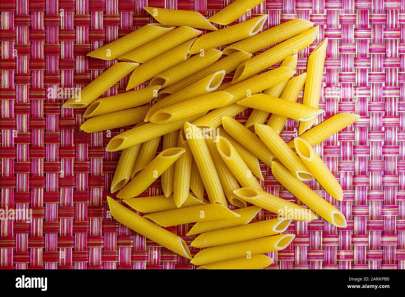 Uncooked penne pasta hi-res stock photography and images - Alamy