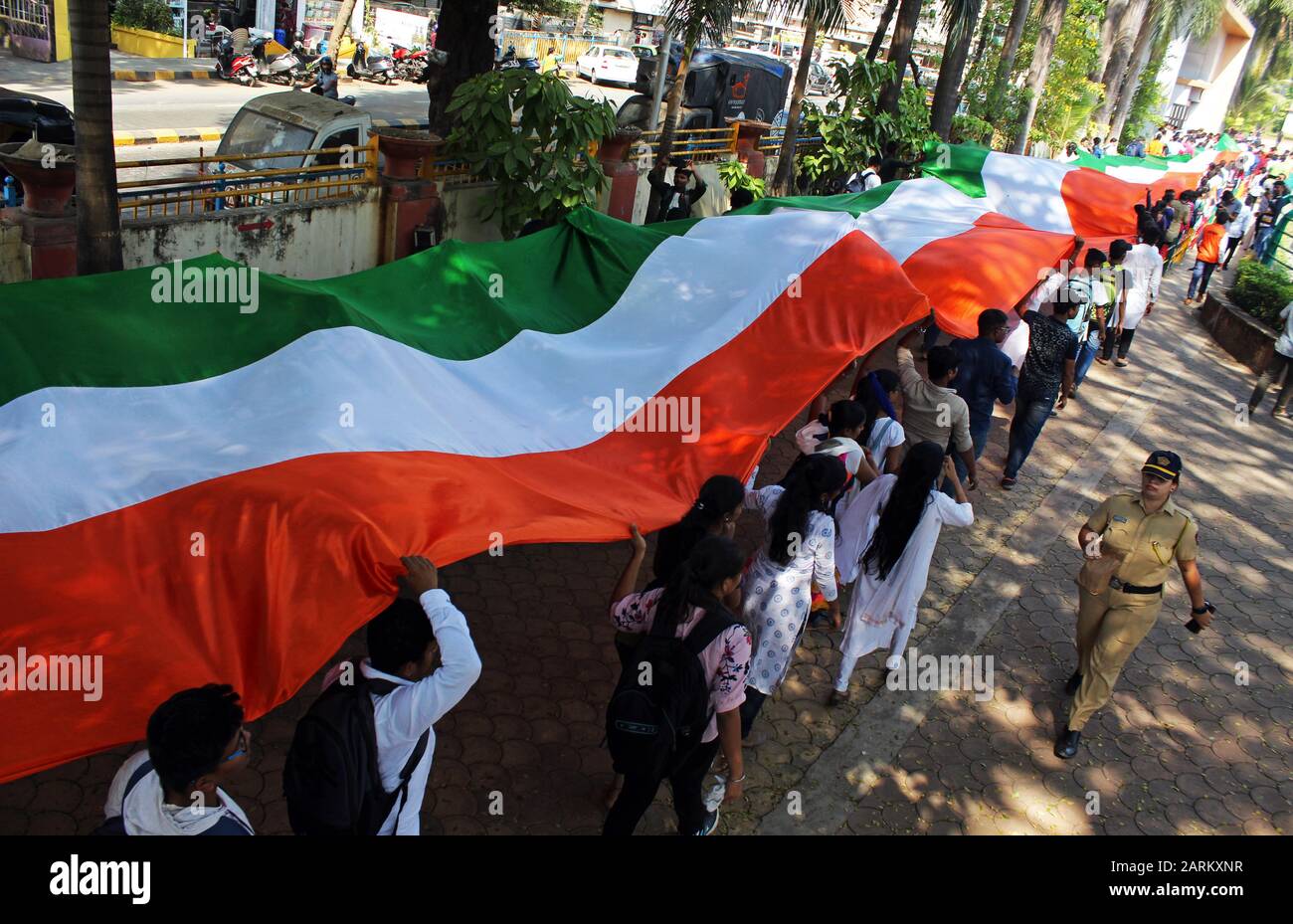 Mumbai, India. 24th Jan, 2020. Protesters hold an Indian national flag ...