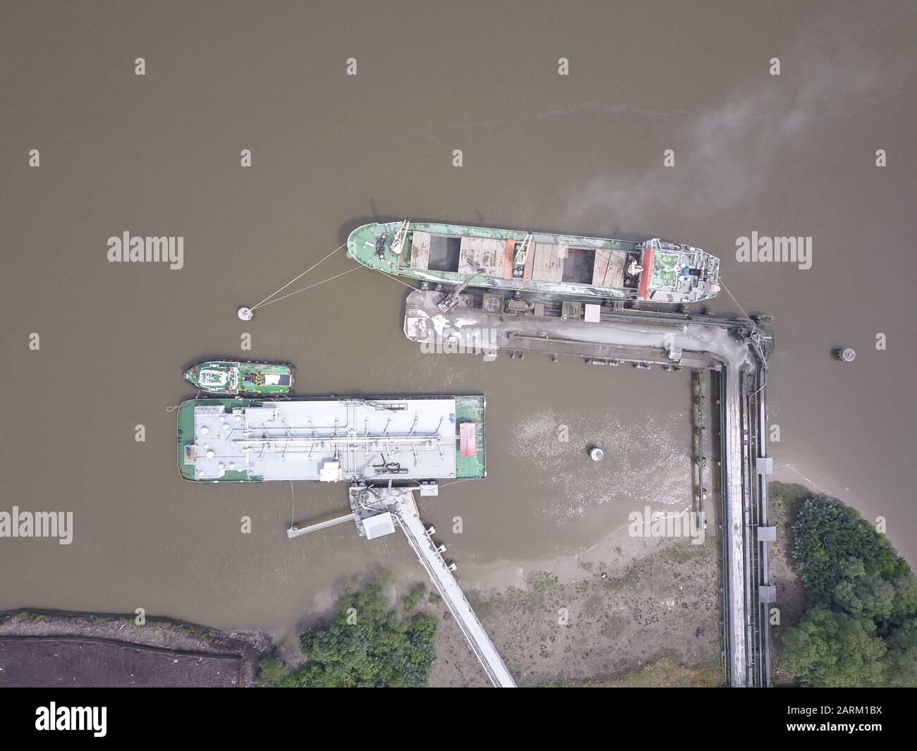 Aerial view of a barrage at the Kuching Isthmus island, with ships ...