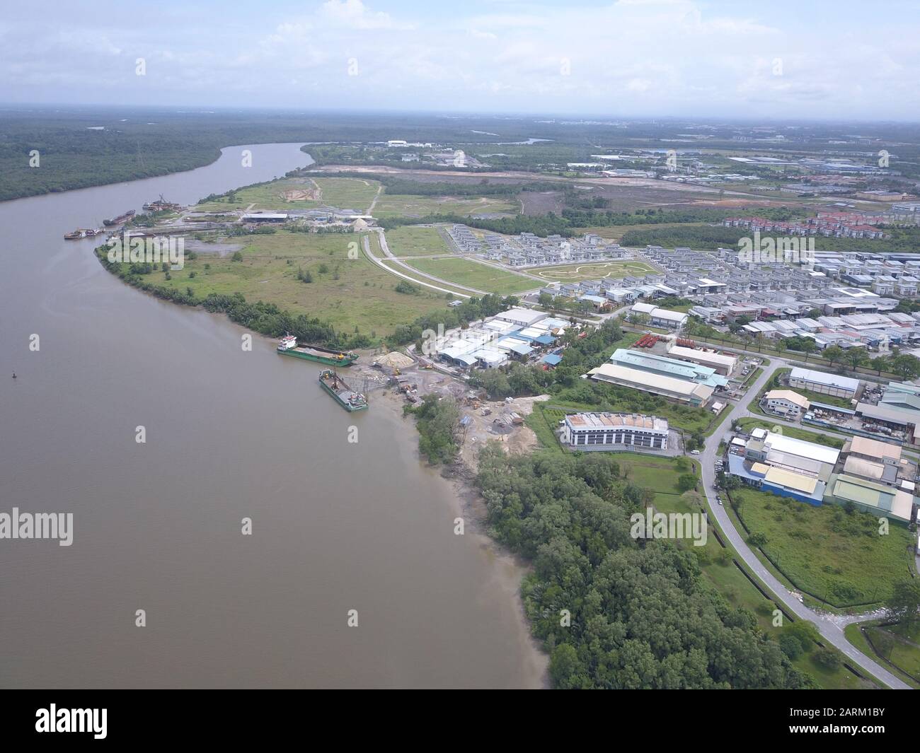 Aerial view of a barrage at the Kuching Isthmus island, with ships ...