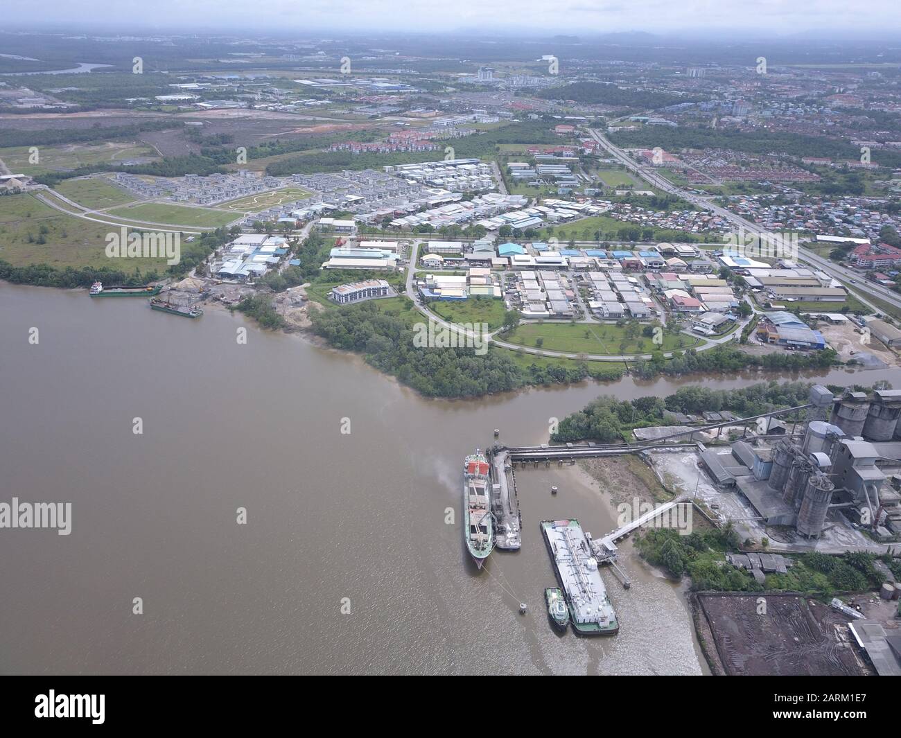 Aerial view of a barrage at the Kuching Isthmus island, with ships ...