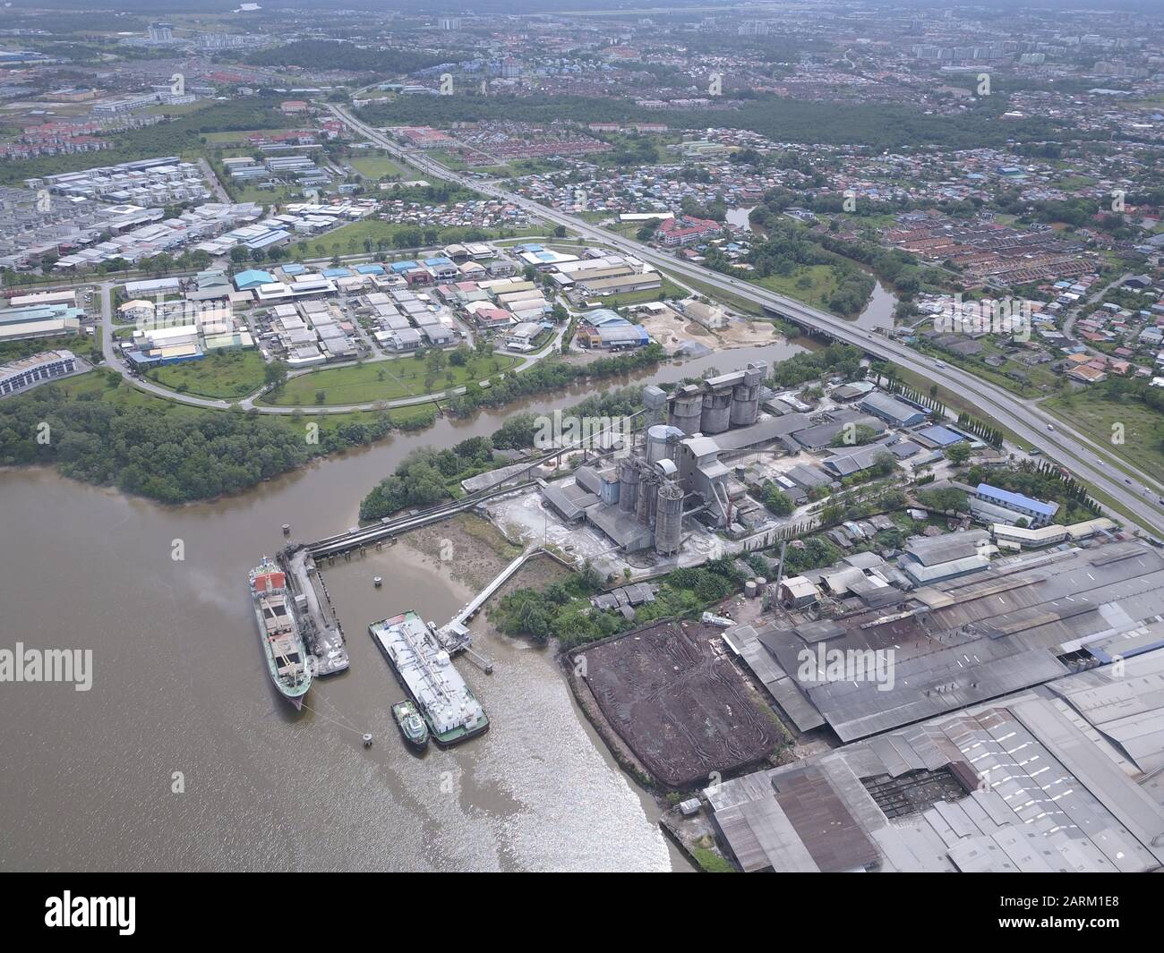 Aerial view of a barrage at the Kuching Isthmus island, with ships ...