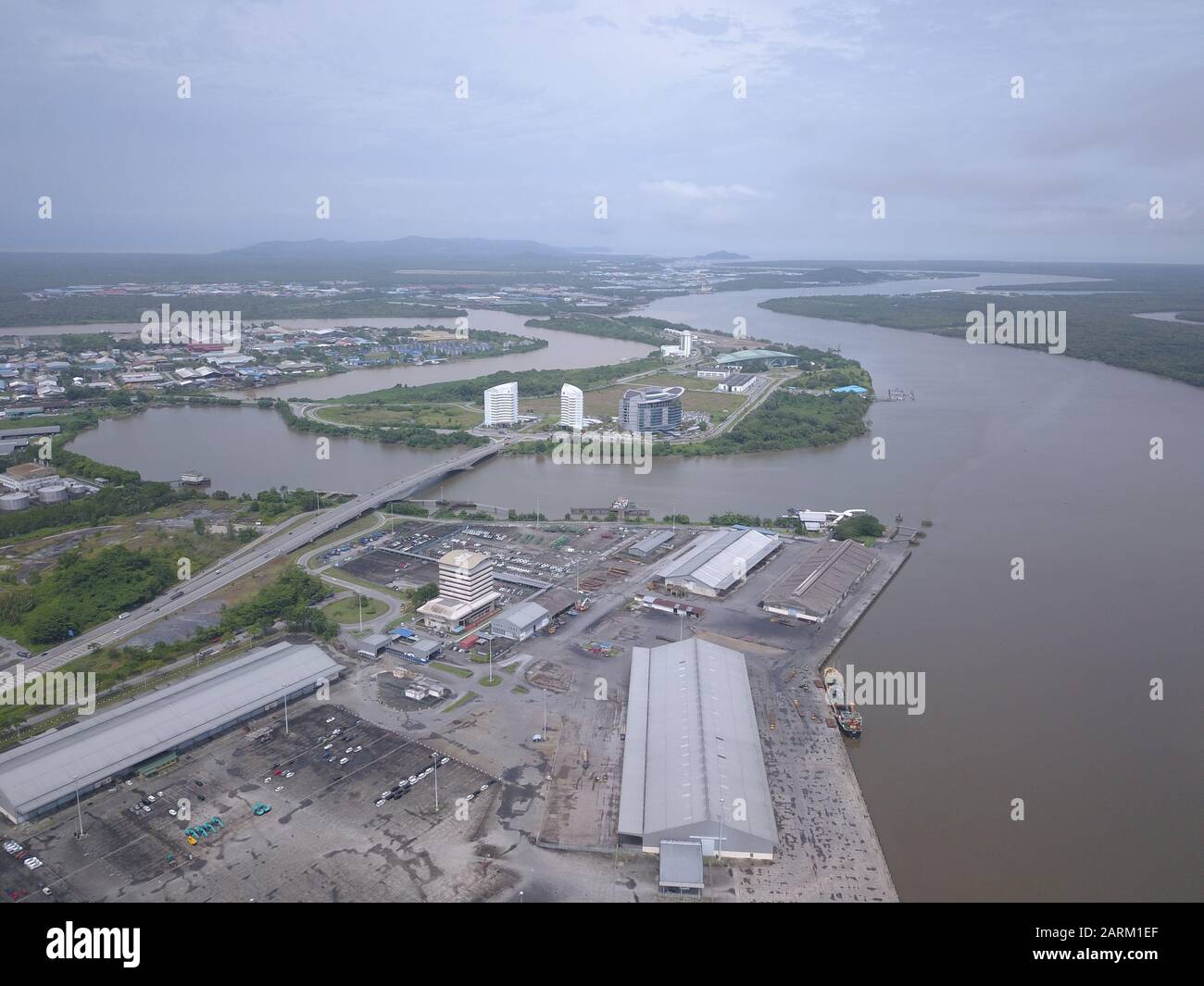 Aerial view of a barrage at the Kuching Isthmus island, with ships ...