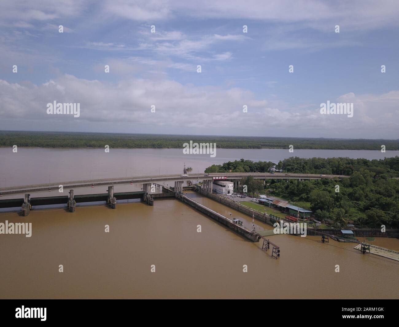 Aerial view of a barrage at the Kuching Isthmus island, with ships ...