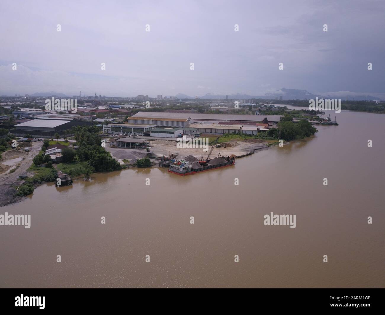 Aerial view of a barrage at the Kuching Isthmus island, with ships ...