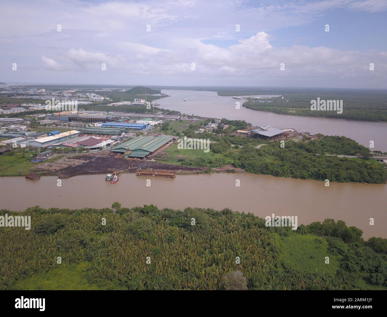 Aerial view of a barrage at the Kuching Isthmus island, with ships ...