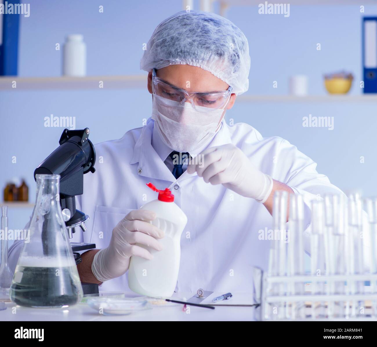 The man in the lab testing new cleaning solution detergent Stock Photo ...