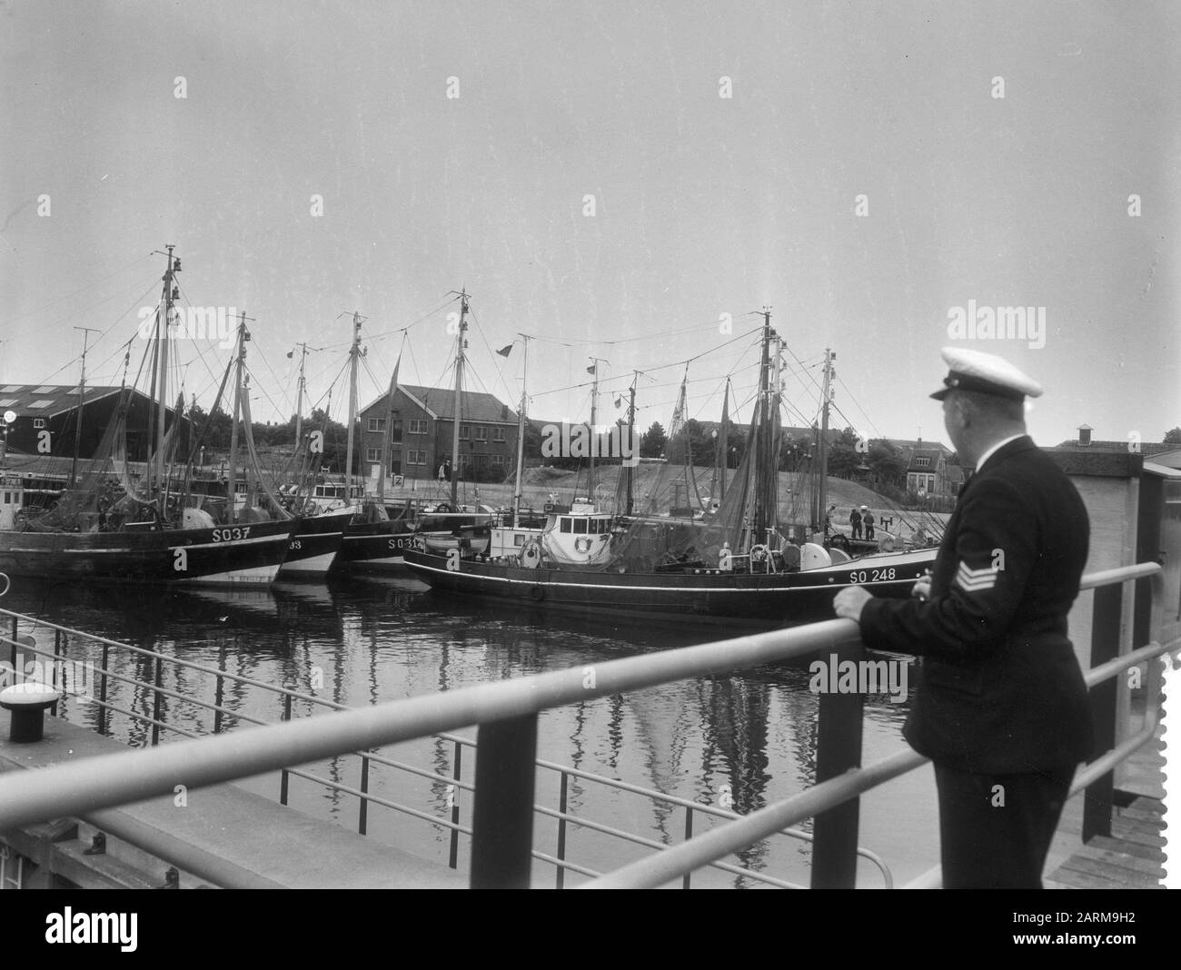 Seven German trailers brought by the minesweeper Meppel. Police officer ...