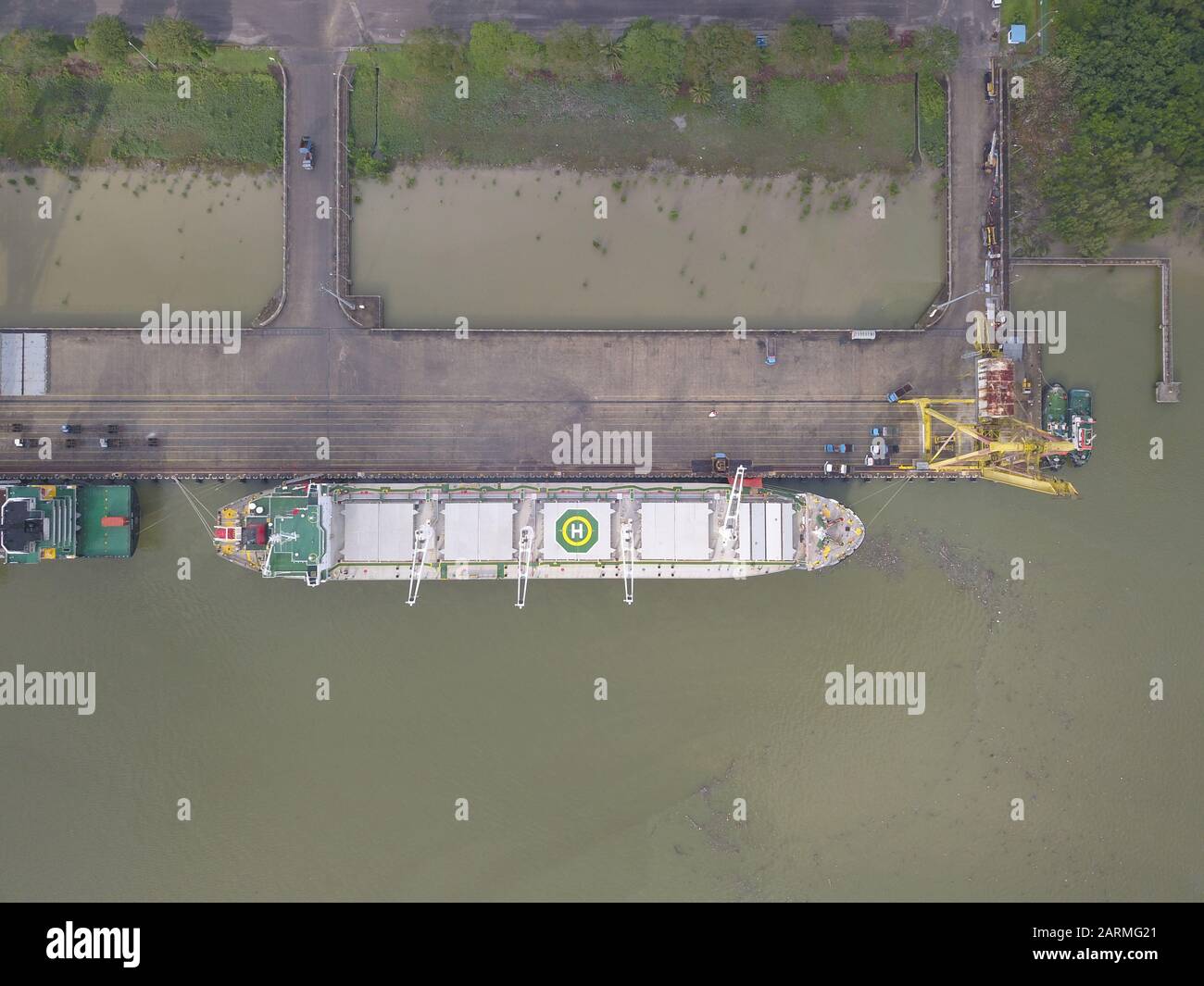 A top down view of a group of fishing vessels or boats in a port or ...