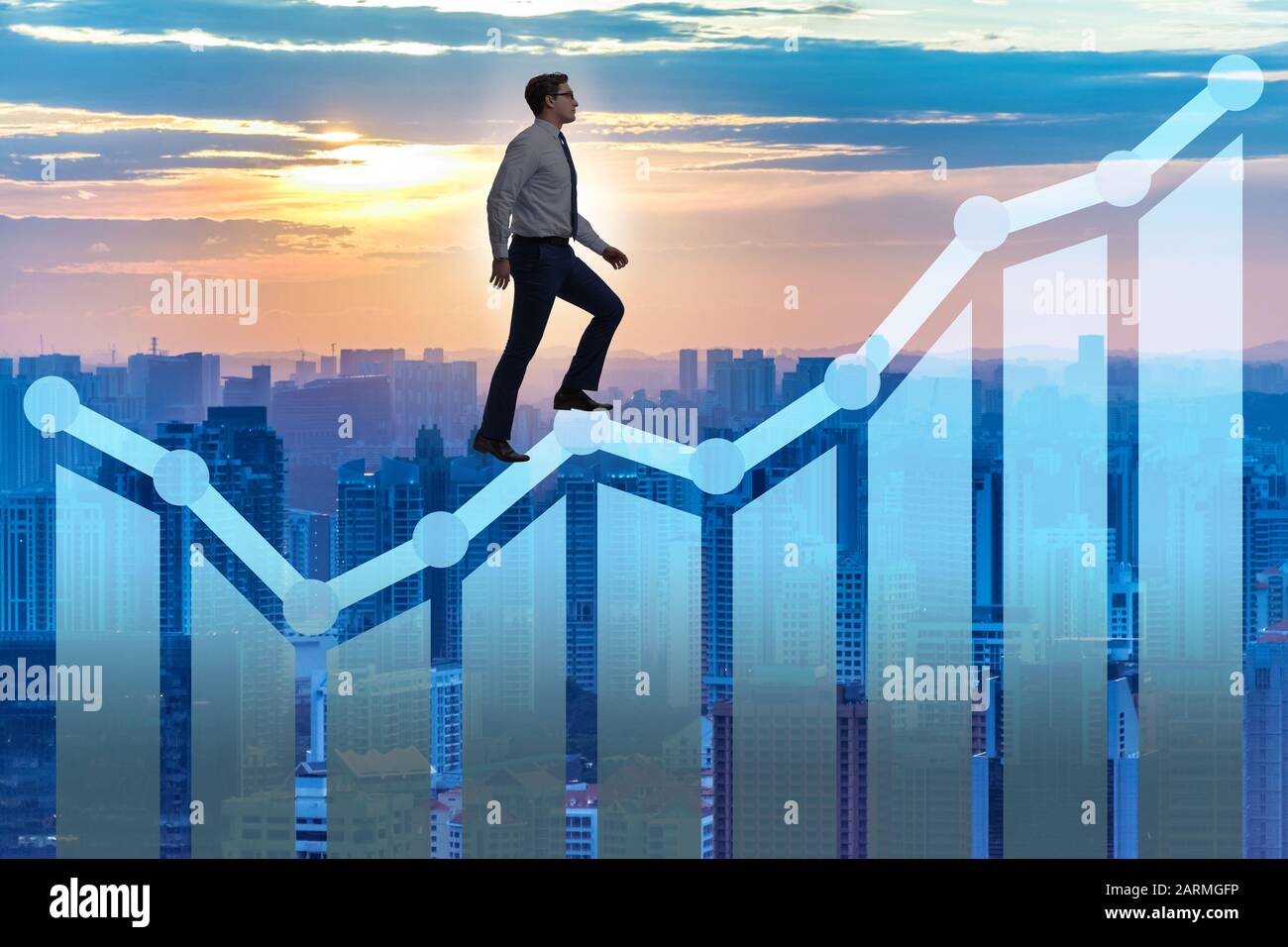 The businessman climbing bar charts in growth concept Stock Photo - Alamy