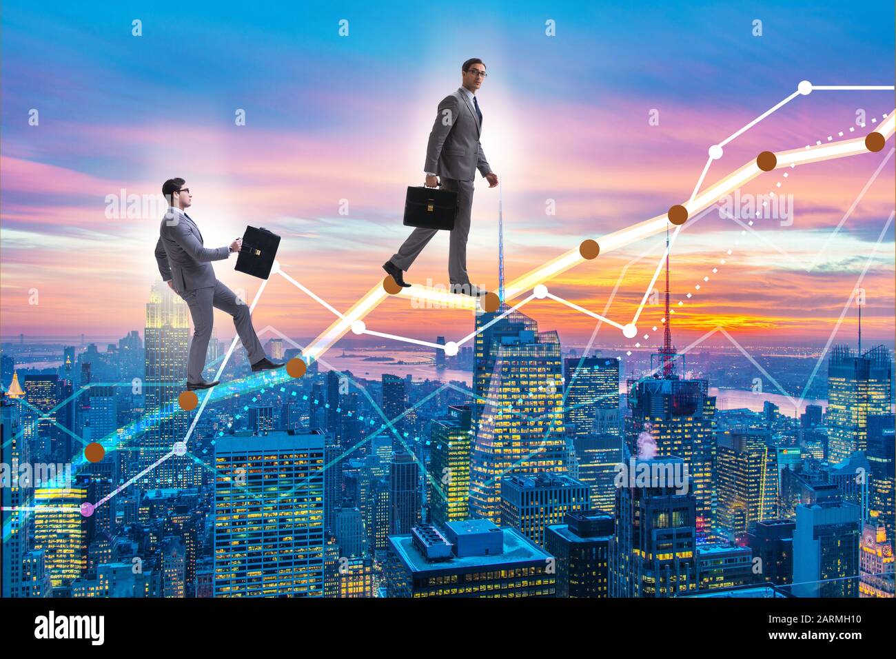 The businessman climbing bar charts in growth concept Stock Photo - Alamy