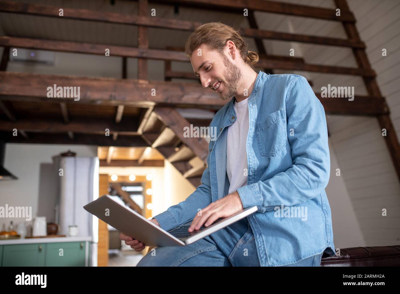 Smiling man using social media for communication Stock Photo - Alamy