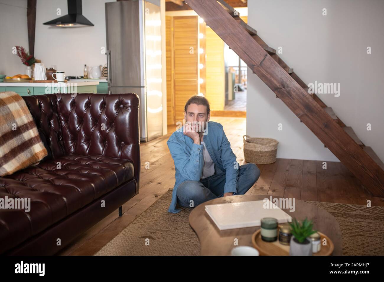 Young man sitting bored on hi-res stock photography and images - Alamy