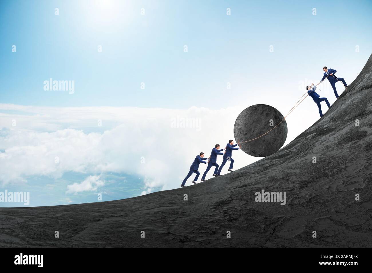 The teamwork example with business people pushing stone to top Stock ...