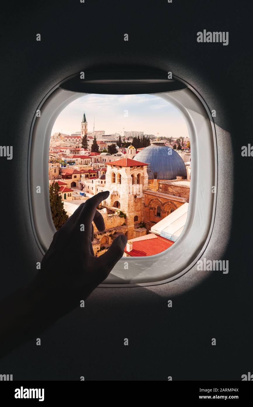 Airplane window with a aerial panorama of Jerusalem, Israel during a ...