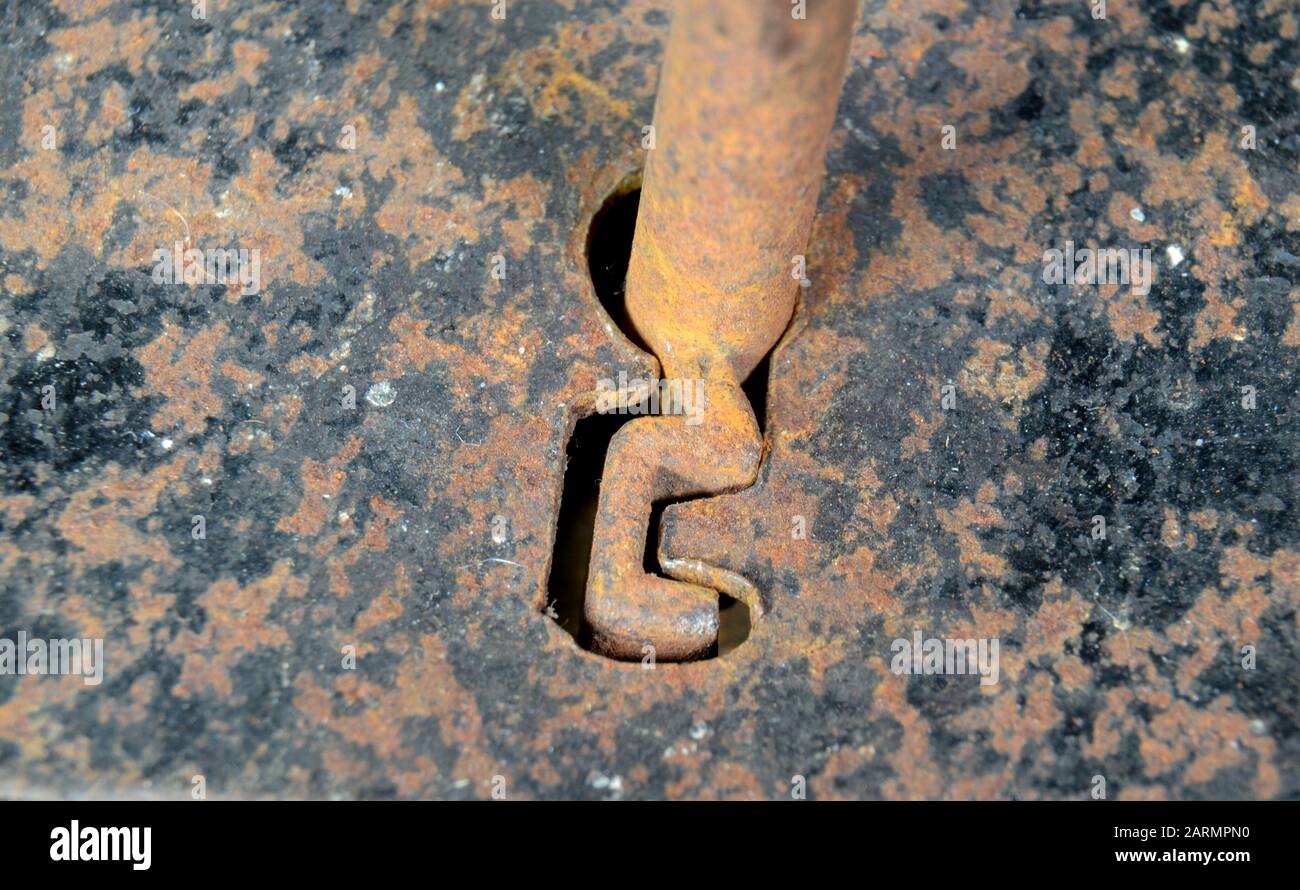 Vintage warded lock with semi inserted key that fits Stock Photo - Alamy