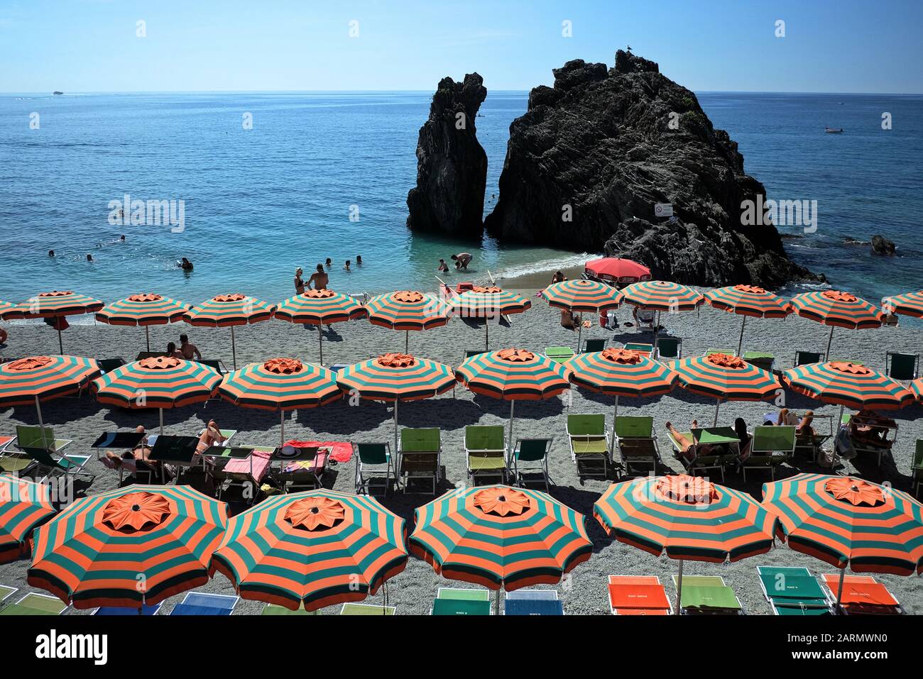 Cinque Terre, five villages of the Italian Riviera by the sea; colourful orange and green ...