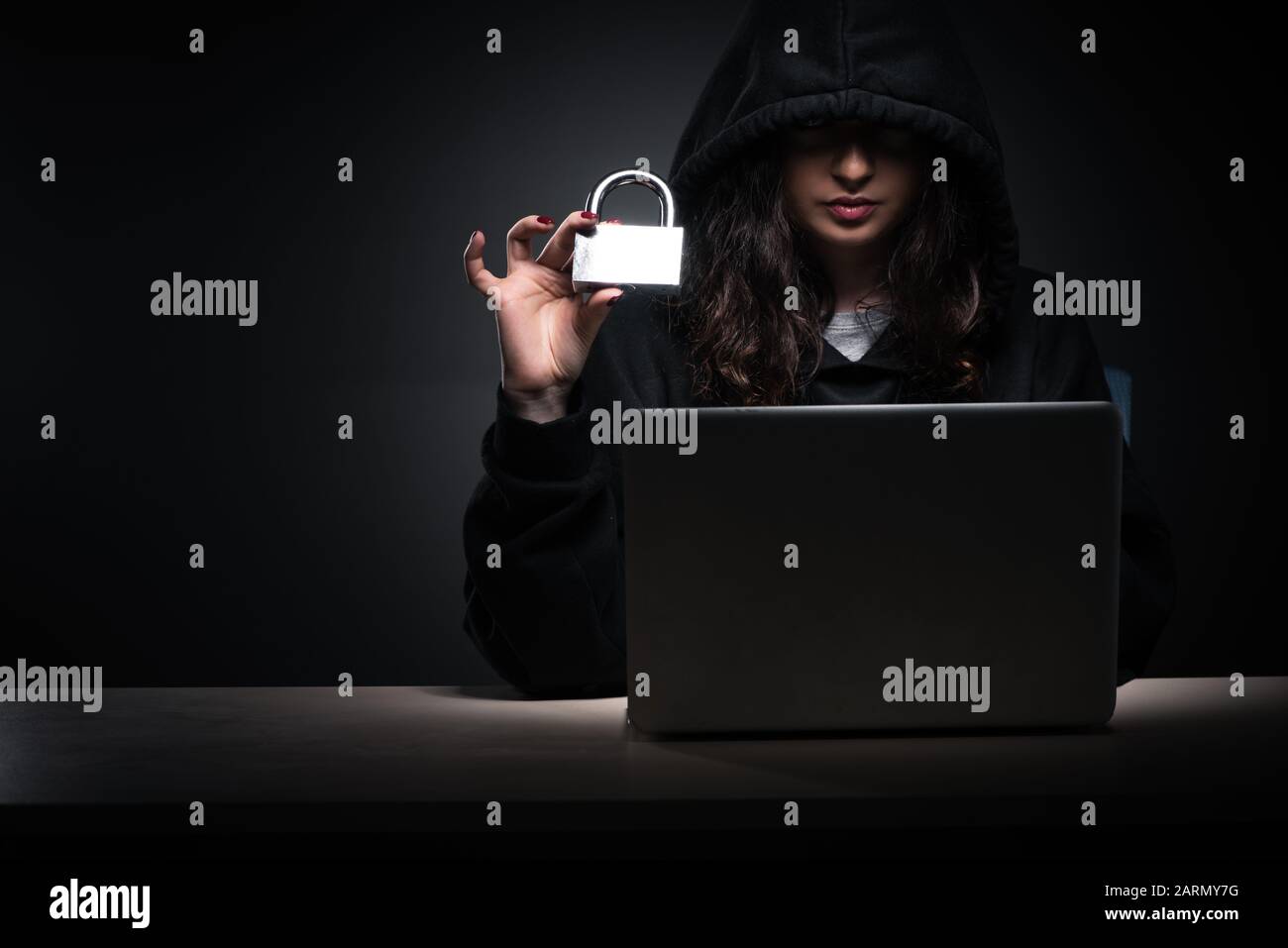 The female hacker hacking security firewall late in office Stock Photo ...