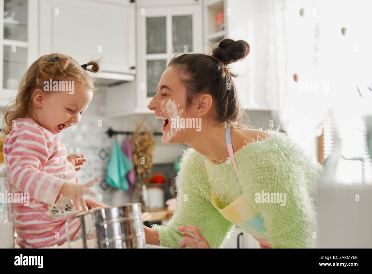 Having fun with flour in the kitchen Stock Photo - Alamy