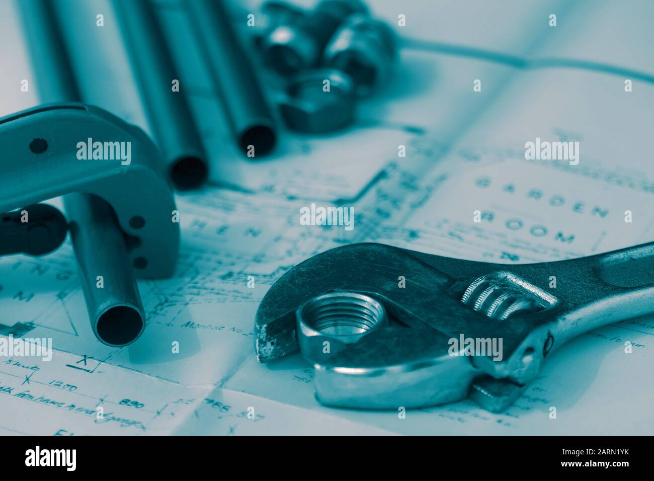 Copper pipe cutter and adjustable spanner wrench tools on a set of ...