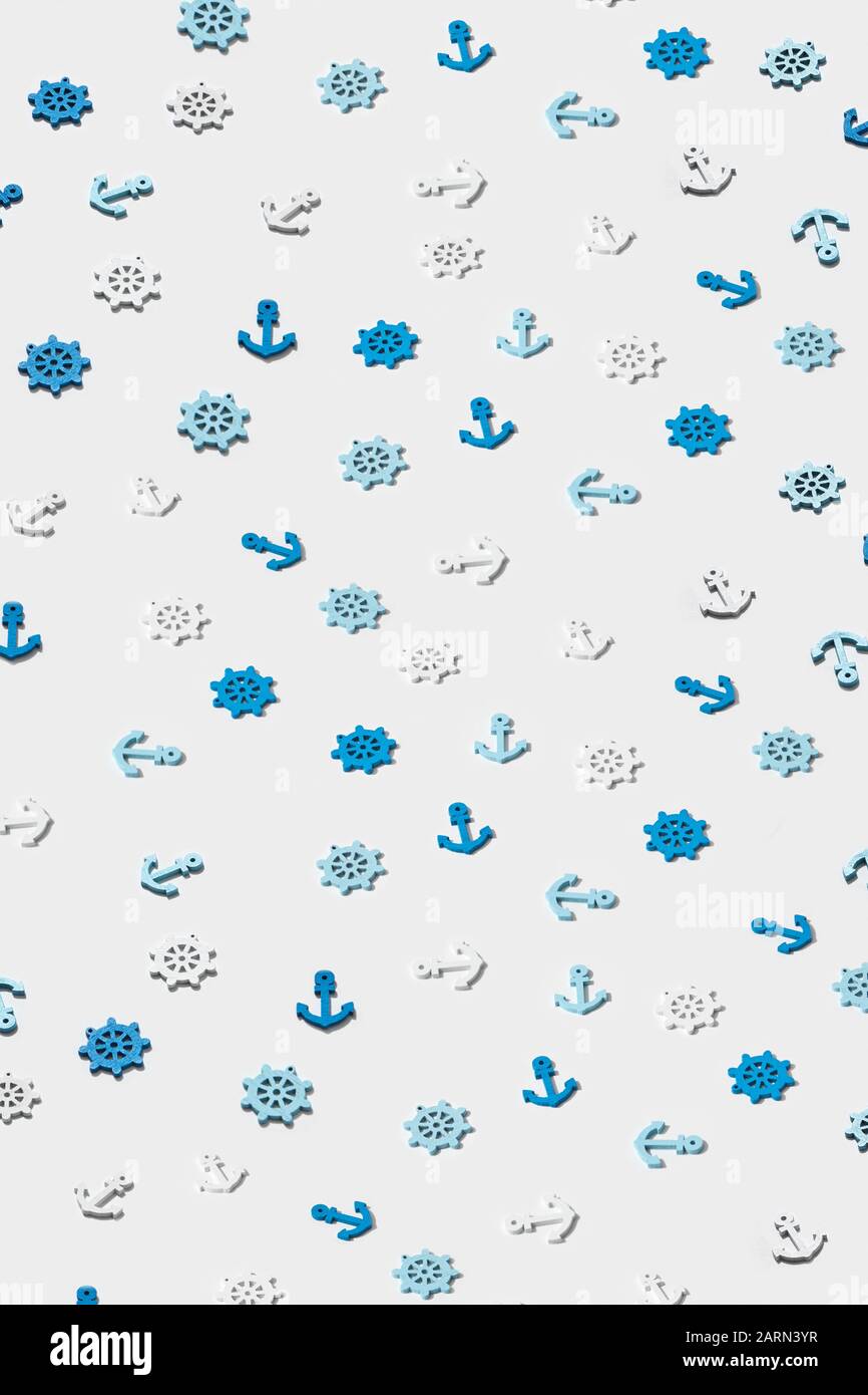 Creative marine pattern from plastic ship's symbols anchors and ...
