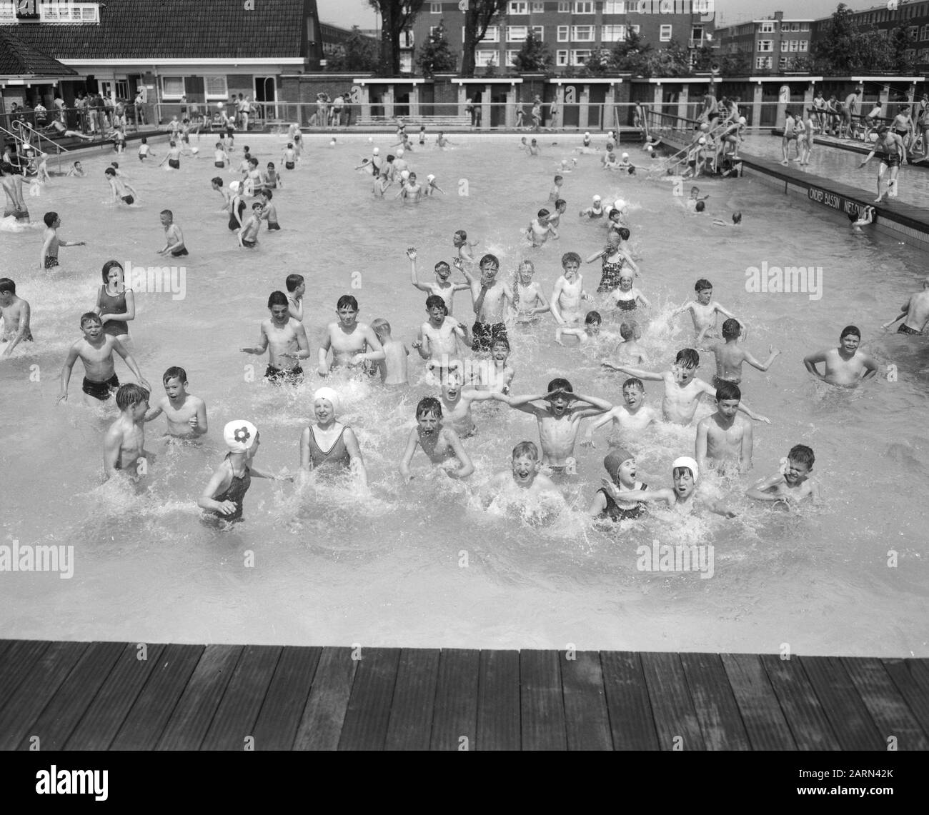 Swimming pool crowd Black and White Stock Photos & Images - Alamy