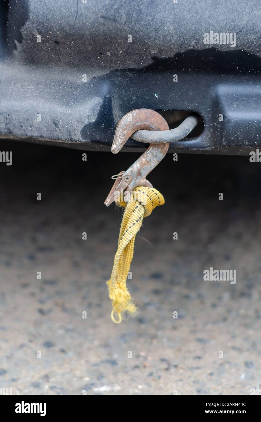 Rusty hook with the rest of the orange cable. A tow rope with a hook ...