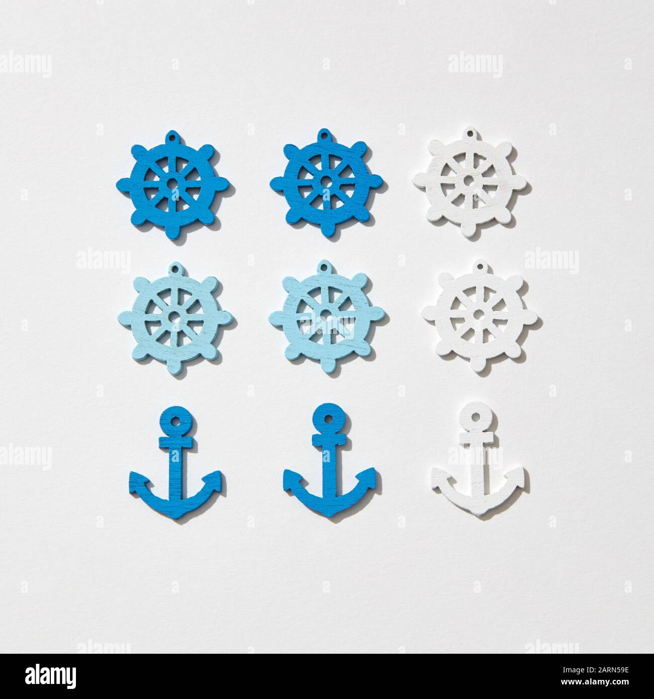 Ship anchors and wheel different colors pattern on a light grey ...