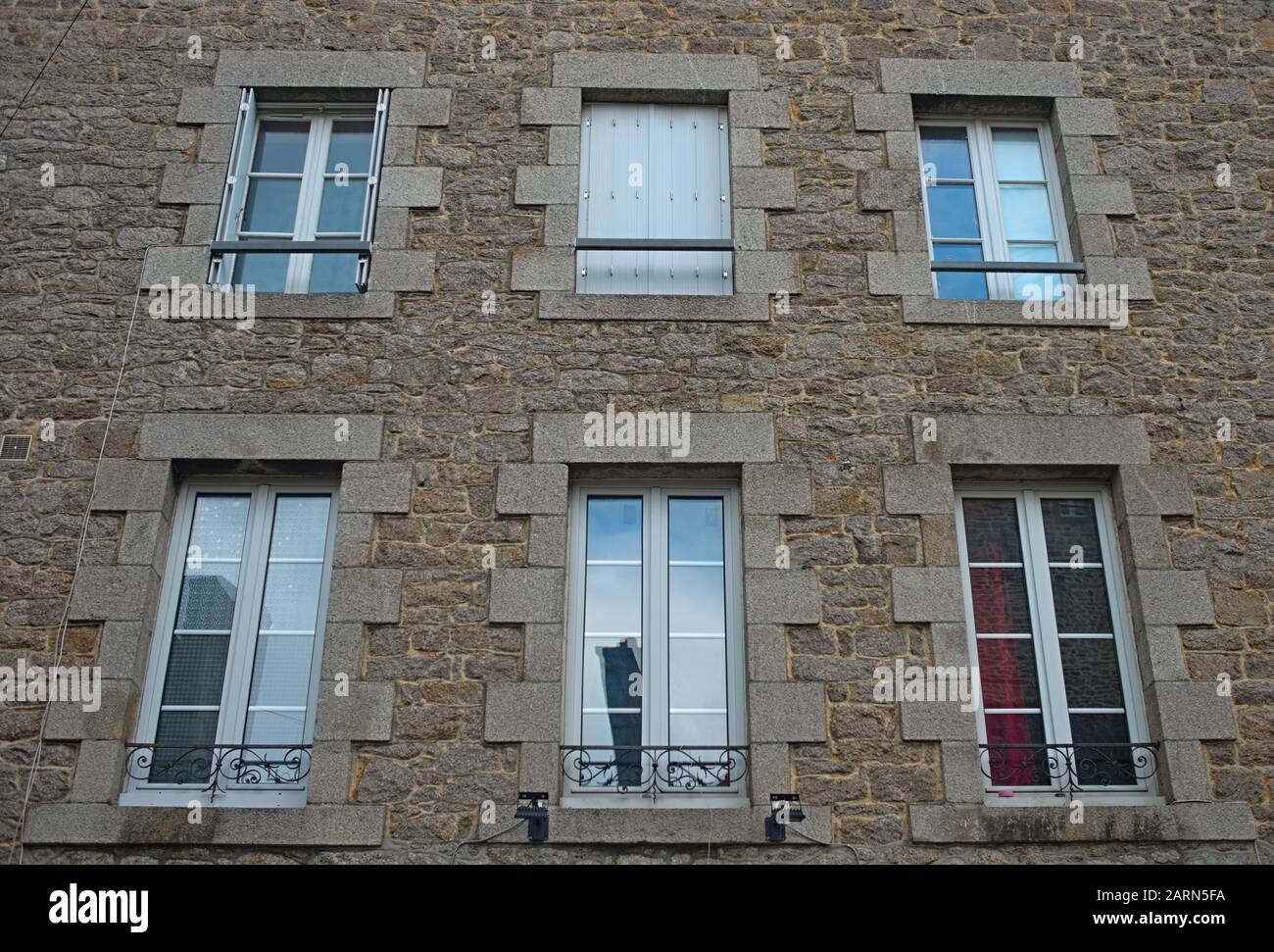 Traditional french stone building with many windows Stock Photo - Alamy
