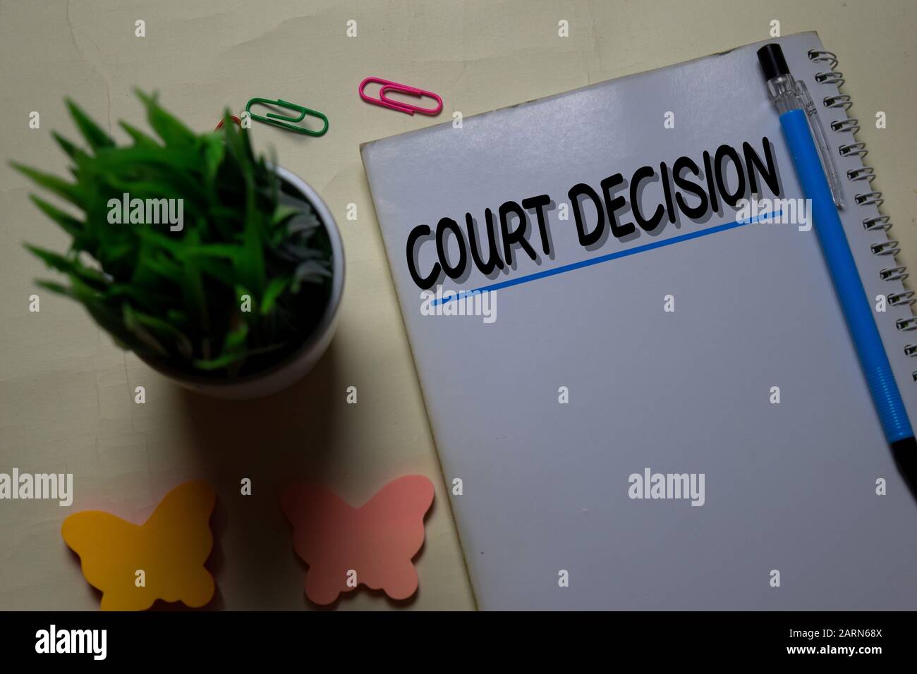 Court Decision write on a book isolated on office desk Stock Photo - Alamy