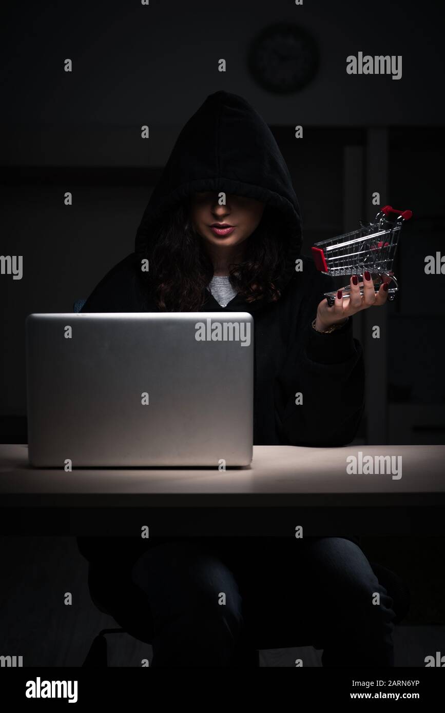 The female hacker hacking security firewall late in office Stock Photo ...