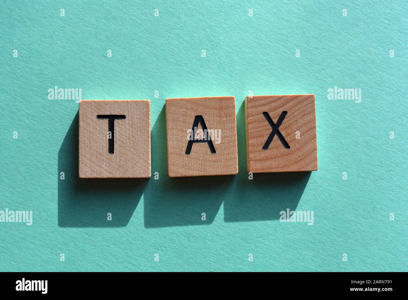 Tax, word in 3d wooden alphabet letters. Creative Concept, finance and ...
