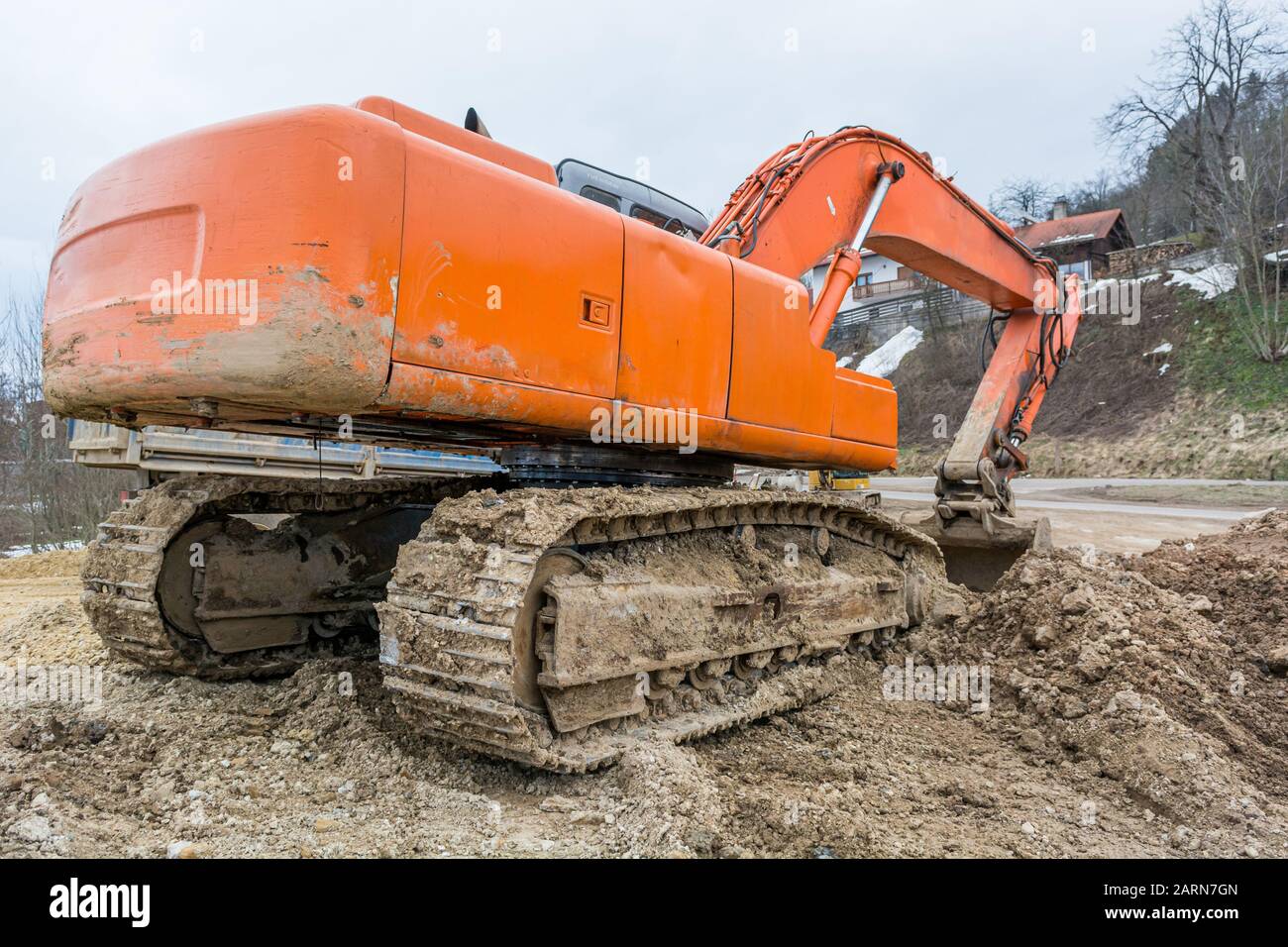 Excavator ready to start digging on a construction site Stock Photo - Alamy
