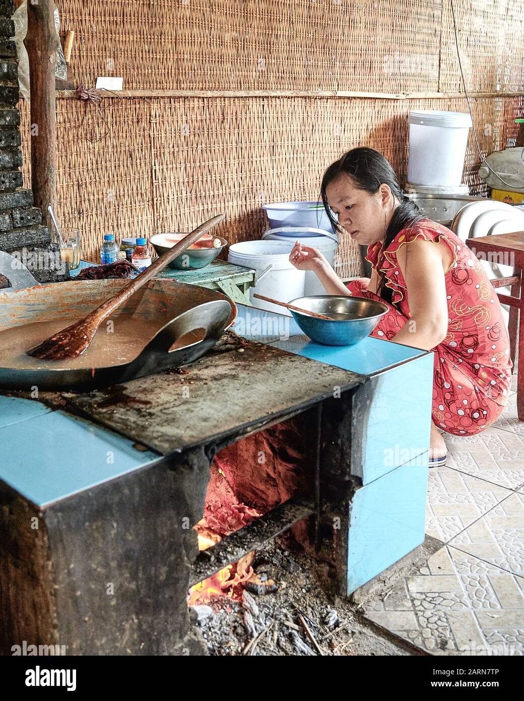 Heating coconut candy. Called Keo dua by the Vietnamese. It is one of ...