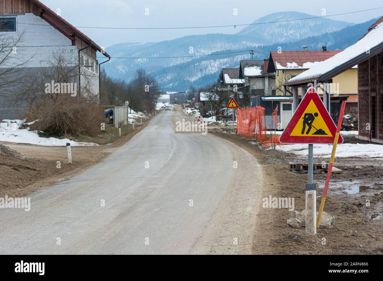 Small town road under construction with safety signs Stock Photo - Alamy