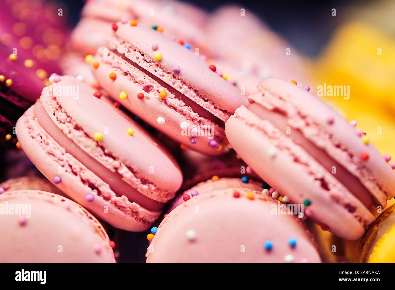 Delicious and beautiful pink, macaroons on sale. Close up. square ...