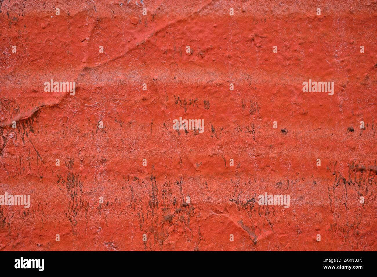 The painted wall of the facade is in bright red. Texture, background ...