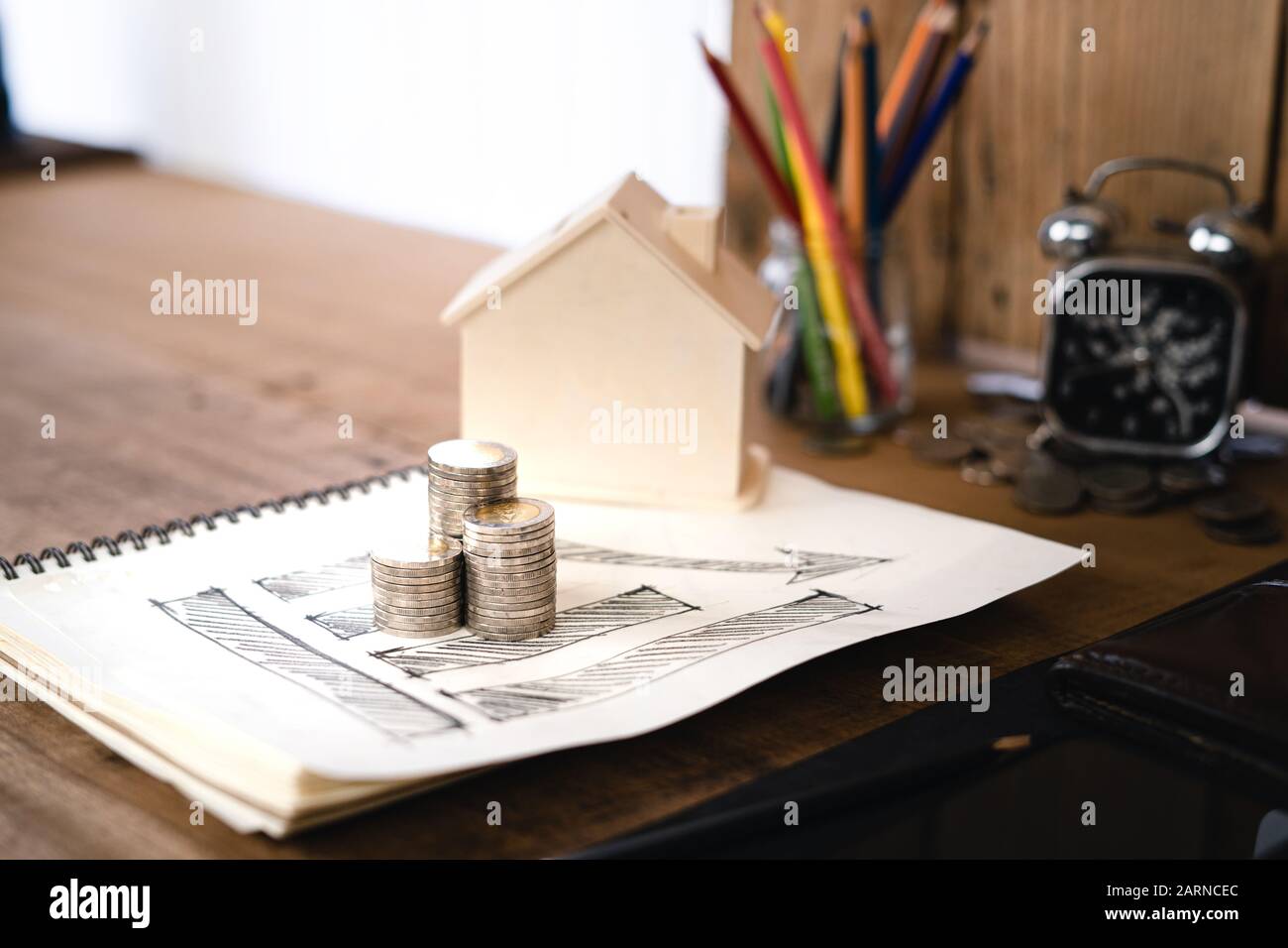 Money growing concept-Money and income graph drawing On Home office ...