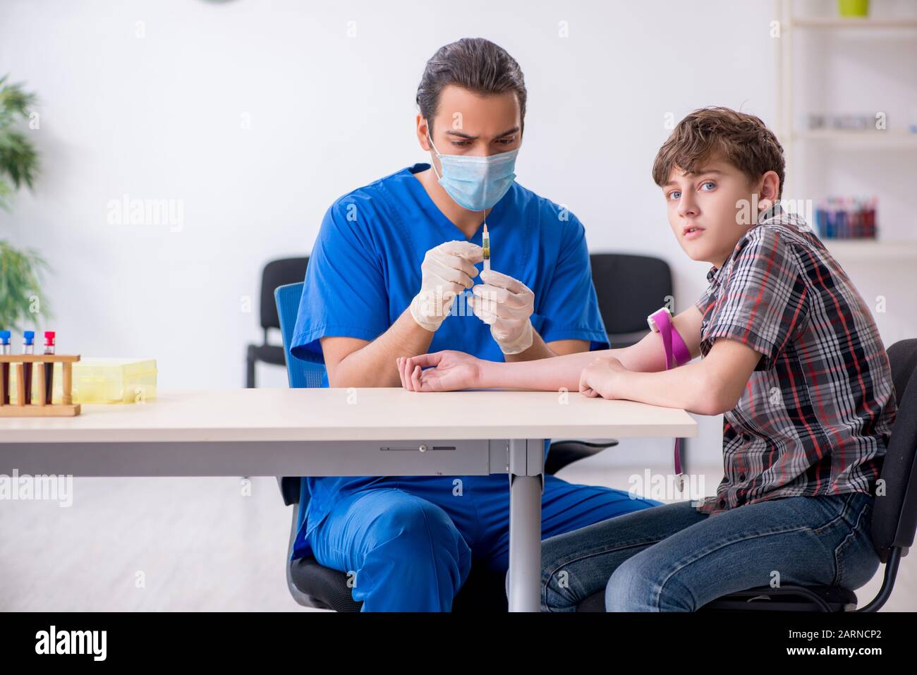 The young boy visiting doctor in hospital Stock Photo - Alamy