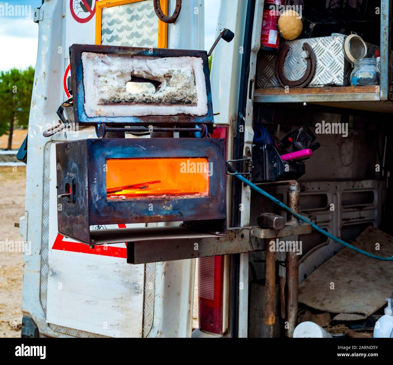 blacksmith's tow truck carrying out home work. In evidence the small ...