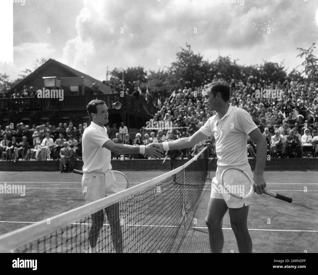 Tennis at Hilversum, John Newcombe and Tom Okker Date: 25 July 1965 Location: Hilversum Keywords ...
