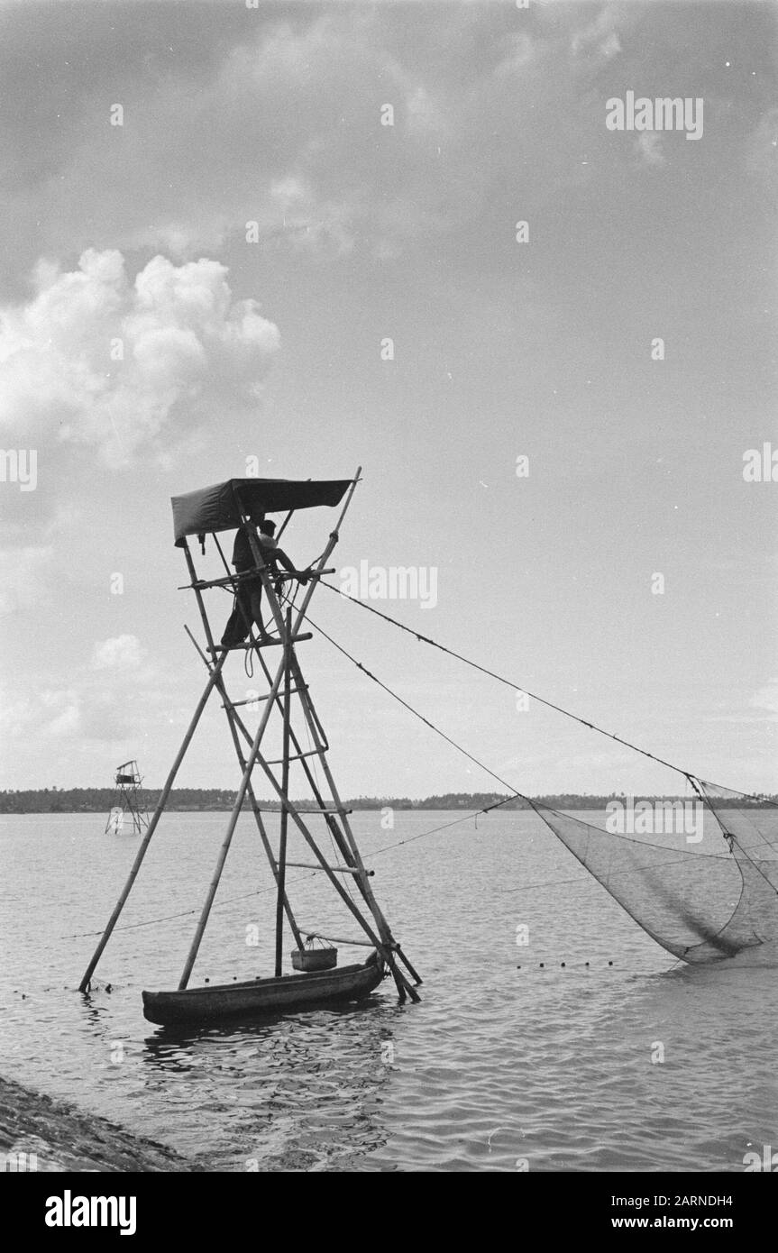 Makassar, Morotai, Ambon Fishermen sitting in a high bamboo chair in ...
