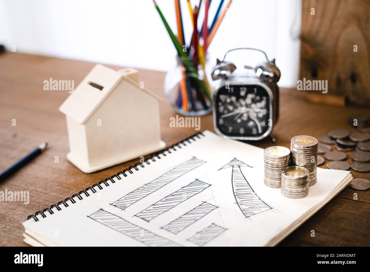 Money growing concept-Money and income graph drawing On Home office ...