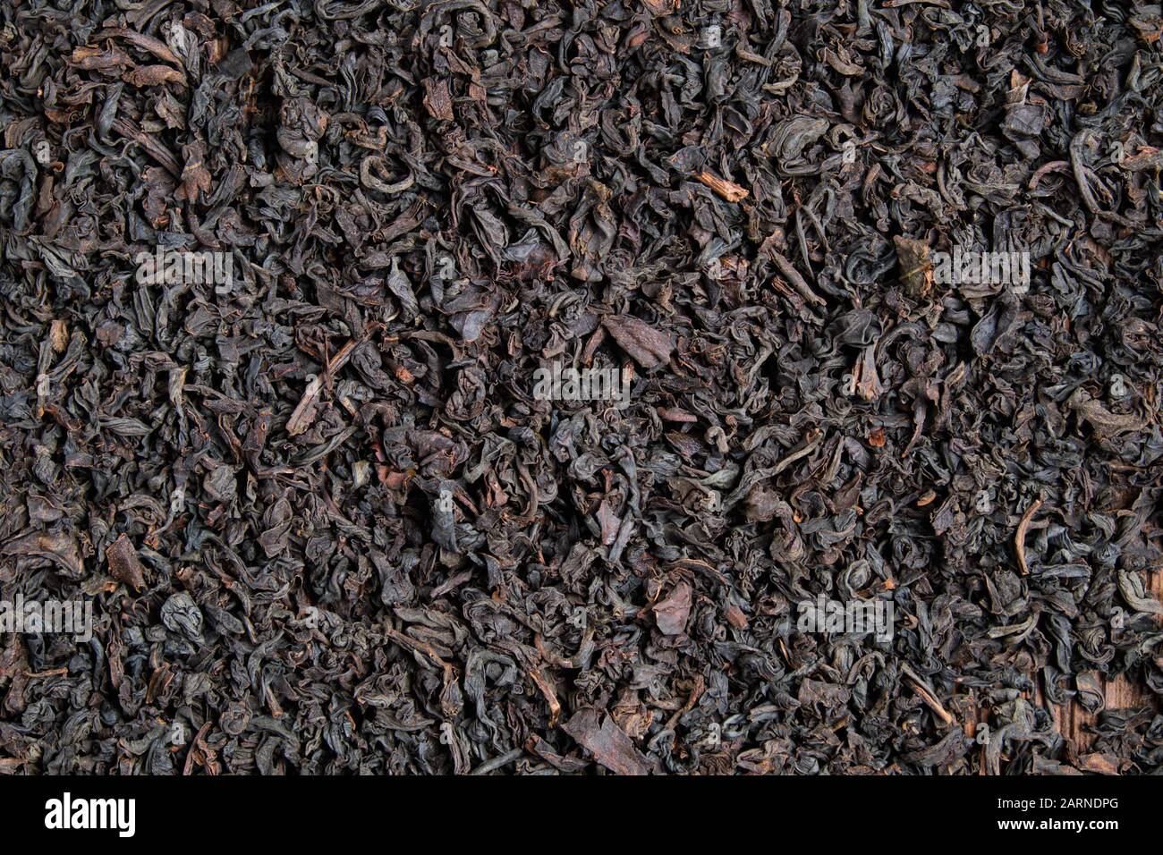 The texture and background of black tea. Top view. Close up Stock Photo ...