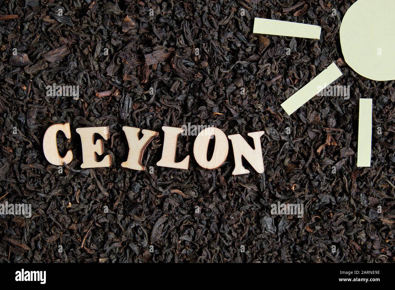 One of the main country producers is ceylon. Letters against the background of black tea with ...